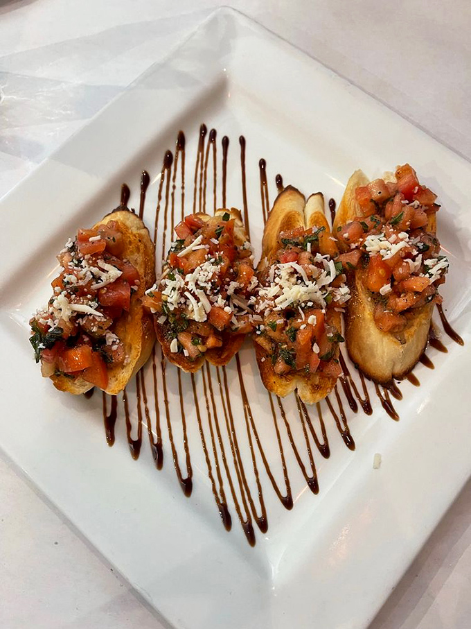 Bruschetta that celebrates simplicity&mdash;toasted bread topped with vibrant tomatoes, fresh herbs, and a shower of cheese. Summer on a plate.