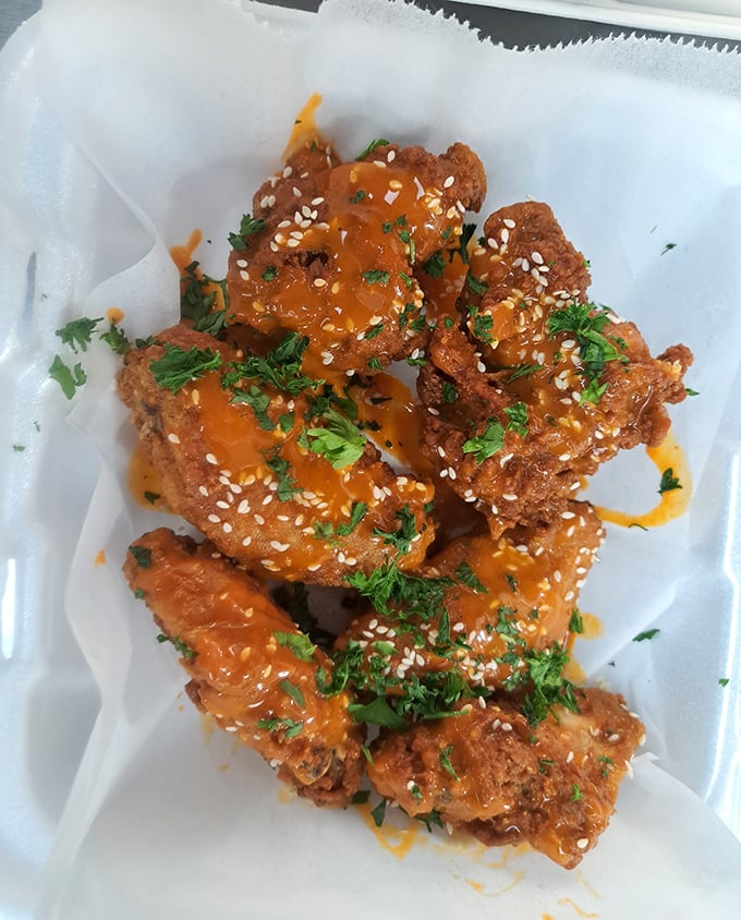 These aren't your average wings &ndash; they're flavor bombs disguised as chicken. The sesame seeds and fresh herbs elevate them to art form status.