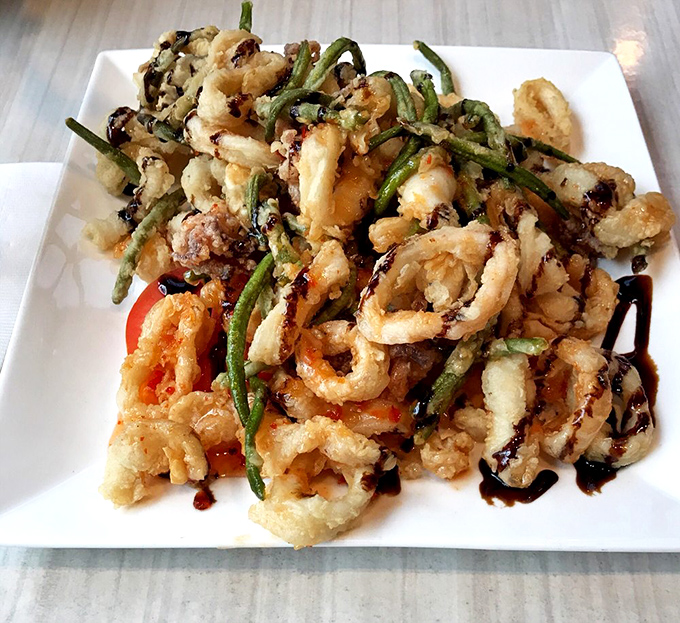 Crispy calamari and green beans tango across the plate in a delicate balancing act of textures that would make any circus performer jealous.