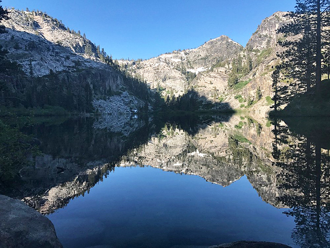 Morning light transforms Emerald Bay into a shimmering pool of soft gold as the sun rises behind the Sierras. Totally worth the early wake-up!