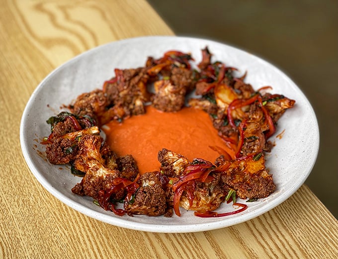Cauliflower gets the star treatment in a ring of vibrant sauce. Who knew vegetables could dress up this fancy?