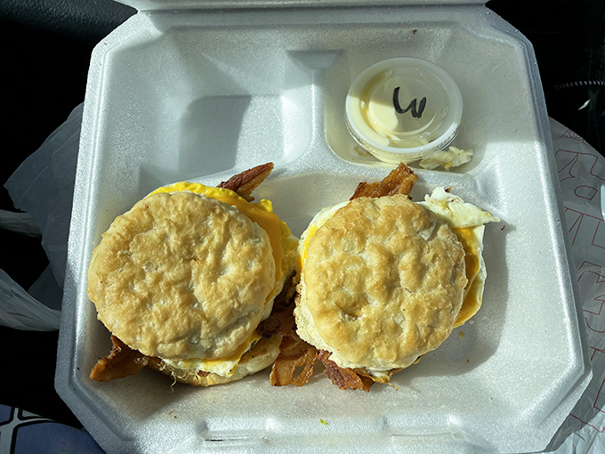 Breakfast sandwiches built for champions. Two perfectly toasted biscuits housing eggs and bacon – portable perfection for morning commuters.