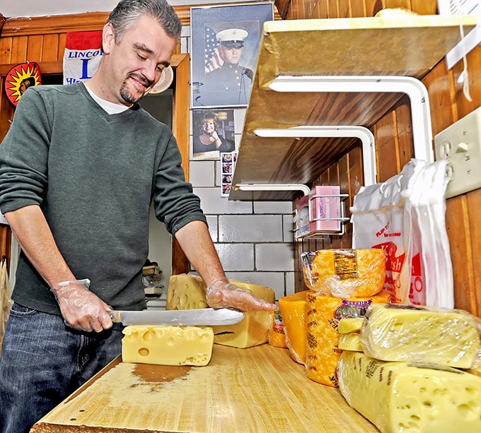 The cheese cutting station&mdash;where the magic happens. Those skilled hands have probably sliced more cheese than most people have seen. Photo credit: Shisler's Cheese House