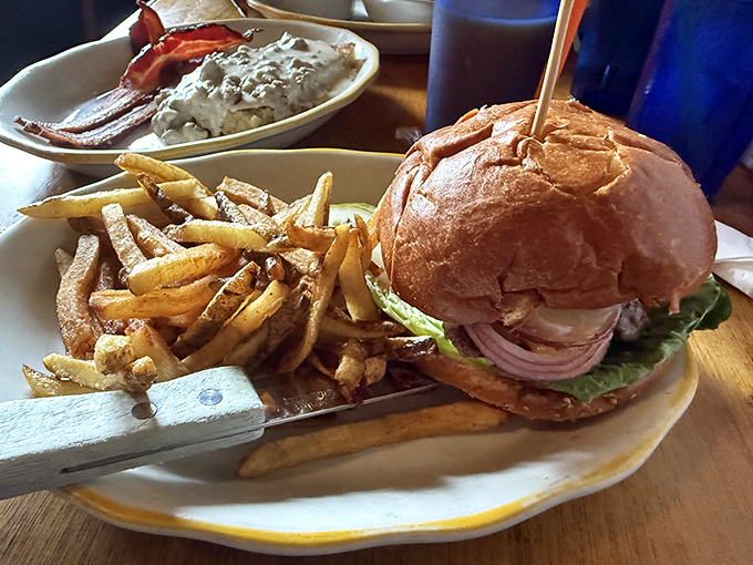 This burger isn't just a meal, it's an event &ndash; towering on its bun throne with a side of fries that look hand-selected for greatness.