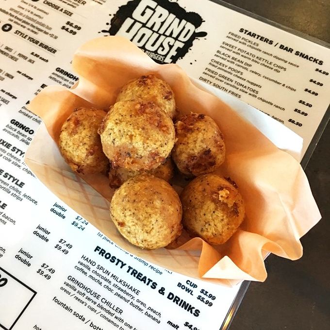 These golden-fried cheese puffs aren't just appetizers – they're spheres of happiness that make waiting for your burger a pleasure, not a chore.