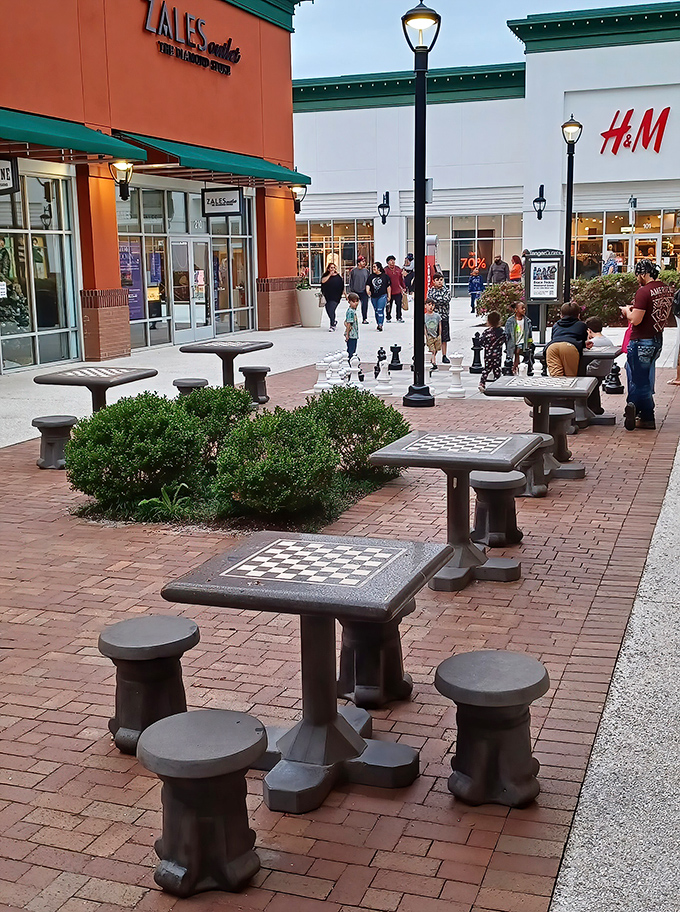 Chess tables invite strategic thinkers to plot their next retail move, or simply offer a place for patient partners to contemplate life while waiting for shoppers.