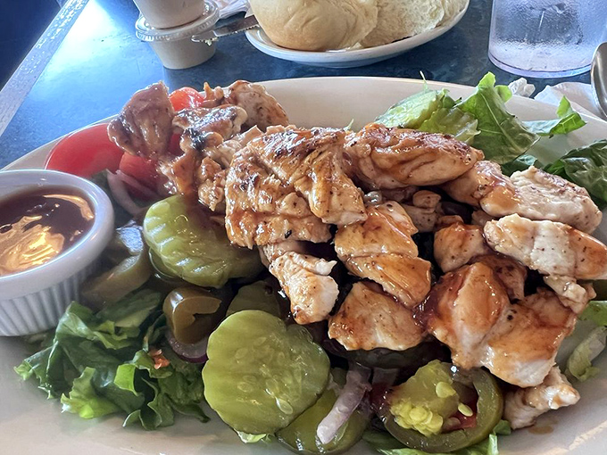Grilled chicken salad that proves healthy eating doesn't have to be punishment. Those pickles are playing the role of flavor exclamation points!