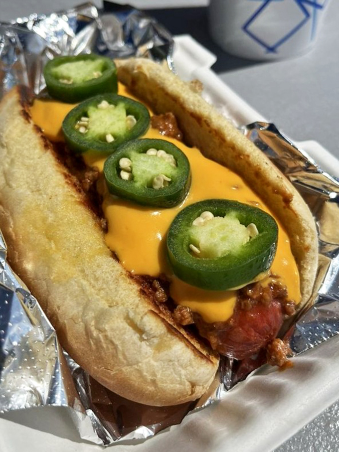 A chili cheese dog accessorized with jalape&ntilde;os &ndash; proving that sometimes more is exactly the right amount.