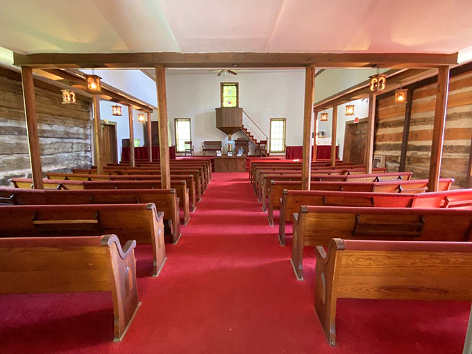 Simple wooden pews and a central pulpit remind us that sometimes, the most profound messages need the least technological assistance.