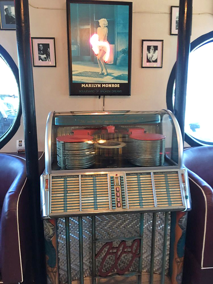 A classic jukebox stands sentinel beneath Marilyn's watchful gaze&mdash;two American icons keeping the nostalgic vibes flowing.