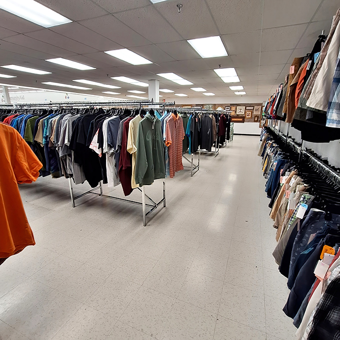 The men's department stretches into the distance, a sea of potential wardrobe upgrades where vintage gems hide among everyday button-downs.