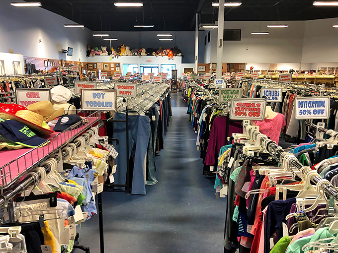 The clothing section stretches toward infinity, a textile galaxy where fashion from every decade awaits its comeback moment.