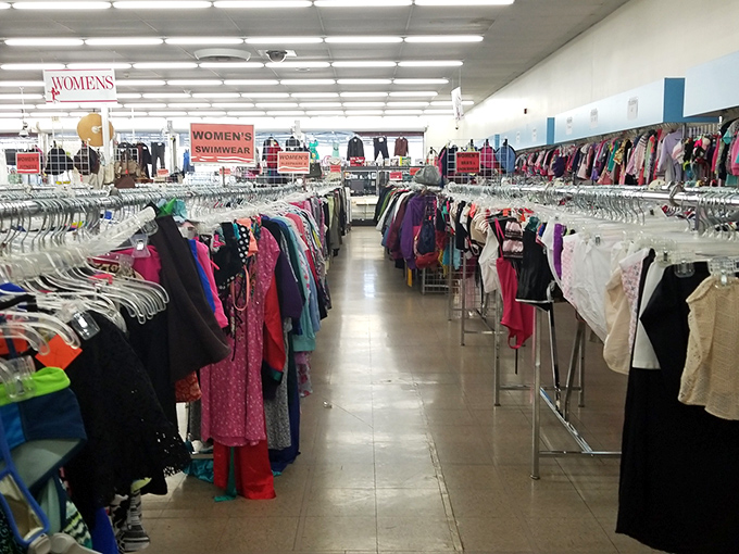 A rainbow of fabrics waiting for their second chance. That perfect dress might be hiding between someone's castoff holiday sweater and a vintage leather jacket.