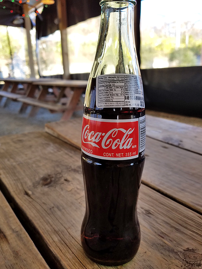 There's something wonderfully nostalgic about sipping an ice-cold Mexican Coca-Cola from a glass bottle while contemplating your next barbecue move.