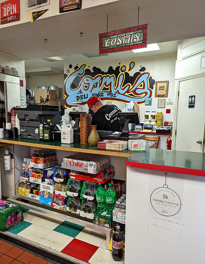 Where sandwich dreams become reality. The colorful Cosmi's mural watches over the ordering counter like a guardian of good taste.