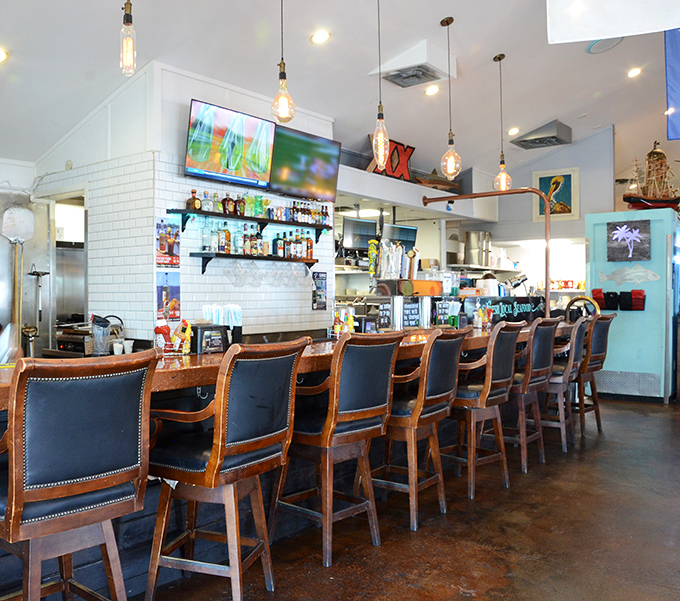 A bar that says "pull up a seat and stay awhile" – where the stools have likely heard more fishing tales than the waters outside.