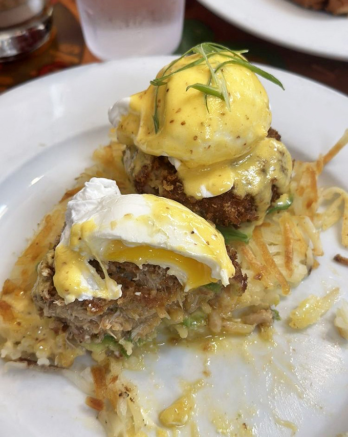 Crab cakes Benedict that defy gravity and expectations, with hollandaise cascading down like a yellow waterfall of buttery goodness.