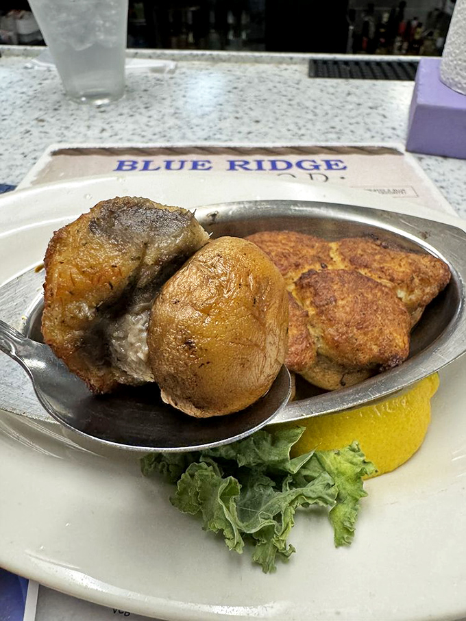 Stuffed mushrooms and crab cake&mdash;a plate that whispers "Virginia knows seafood" with every savory, butter-kissed bite.