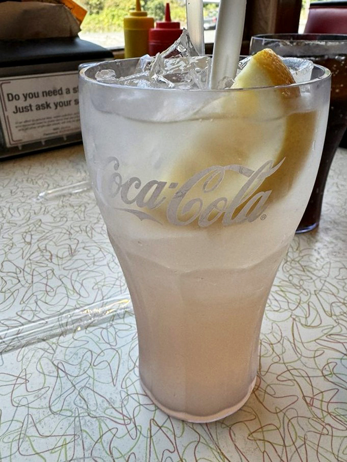 A frosty glass of what appears to be lemonade&mdash;the perfect counterbalance to a hearty burger. Refreshment, simplified.