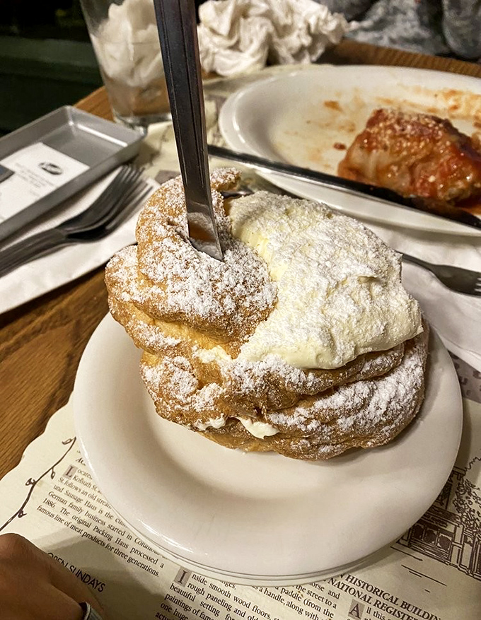 This towering cream puff dessert looks like something from a fairy tale bakery dream.
