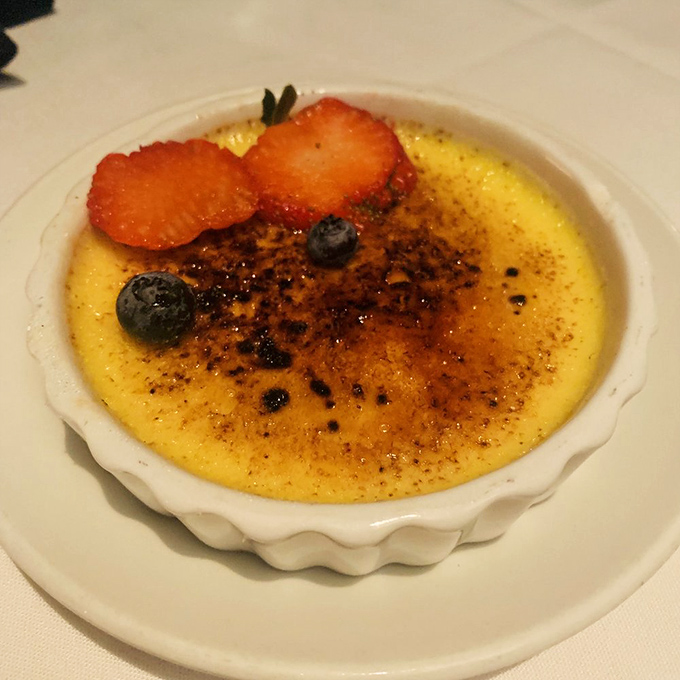 A cr&egrave;me br&ucirc;l&eacute;e with that perfect glass-like sugar top that makes that satisfying crack when your spoon breaks through. Dessert ASMR at its finest.