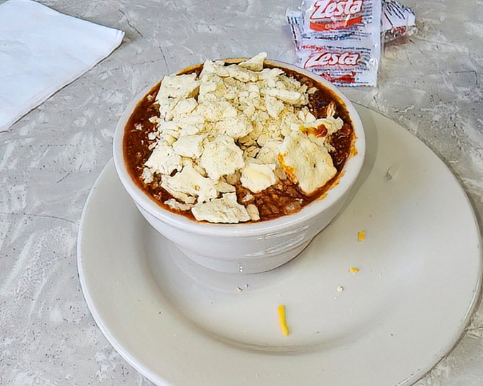 This isn't just chili&mdash;it's a warm hug in a bowl, topped with crackers and cheese. Comfort food that speaks a universal language.