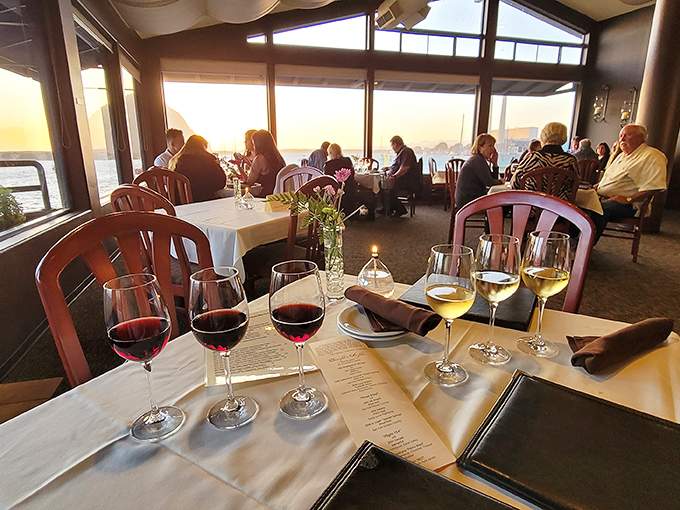 Wine glasses catch the sunset glow as diners settle in for an evening where the conversation flows as smoothly as the California vintages.