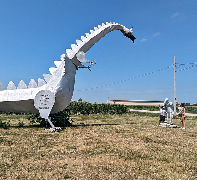 Visitors gather around their fire-breathing friend, creating memories that will outlast any social media trend or viral video.
