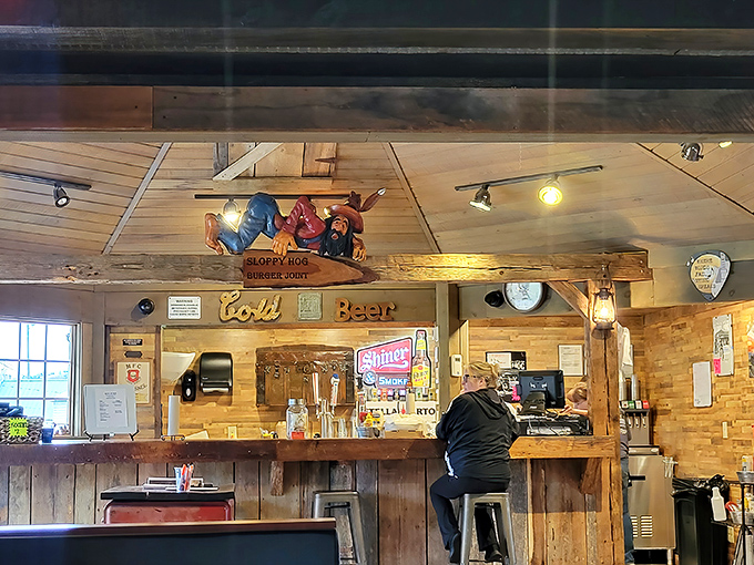 Behind the bar, rustic charm meets function in a space where conversations flow as easily as the beverages. No mixology degree required.