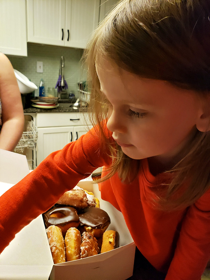 The magic moment when a child discovers the donut universe. That look of wonder says it all&mdash;life will never be quite the same again.