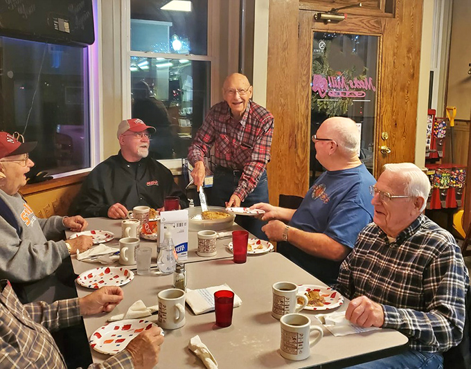 Where strangers become friends over coffee and pancakes. These gentlemen have probably solved all the world's problems by now.
