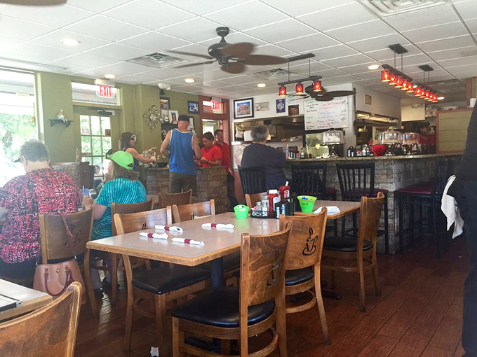 The counter seating offers front-row tickets to the culinary show. Regular customers and first-timers alike gather at the altar of breakfast excellence.