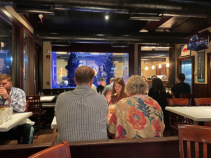 Conversations flow as freely as the cocktails in this dining room where strangers often become friends over shared bites of seafood excellence.