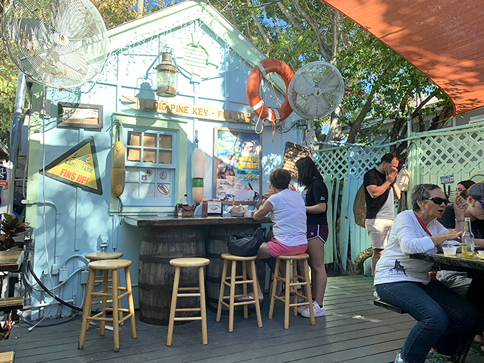 The outdoor patio—where the Florida sunshine is complimentary and the seafood is worth writing home about.
