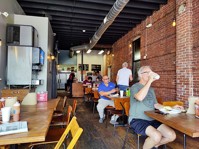 Fellow pilgrims to the barbecue promised land, enjoying the fruits of patience and wood smoke in a space that feels like a carnivore's sanctuary.