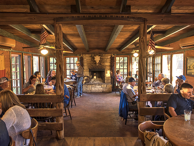 Diners gather in this wood-beamed sanctuary not just for food, but for the communal experience of Texas hospitality at its finest.