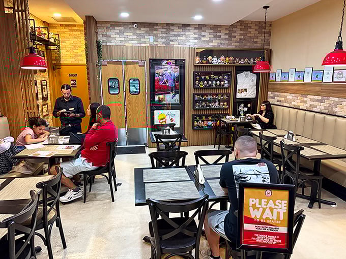 Even the most serious diners can't help but smile in this space where brick walls, wooden chairs, and "Please Wait" signs create the perfect backdrop for potato-induced happiness. 
