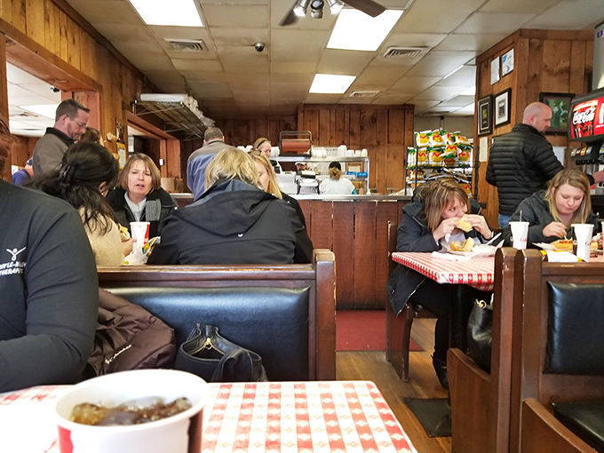 No pretension here&mdash;just people from all walks of life united in the universal language of "this sandwich is worth shutting up for."