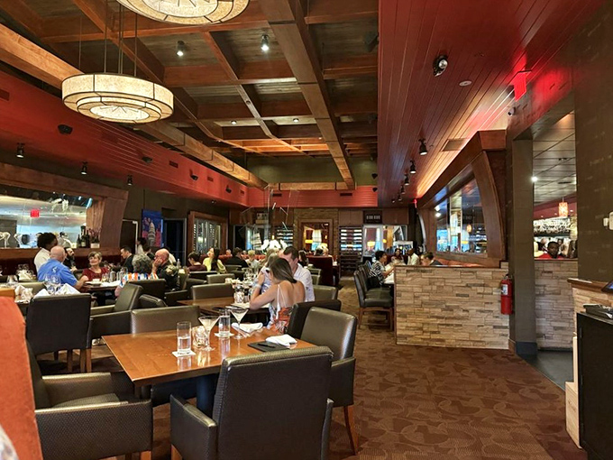 Every table tells a story of connection and conversation, with the restaurant's warm wood tones creating an instant sense of belonging.