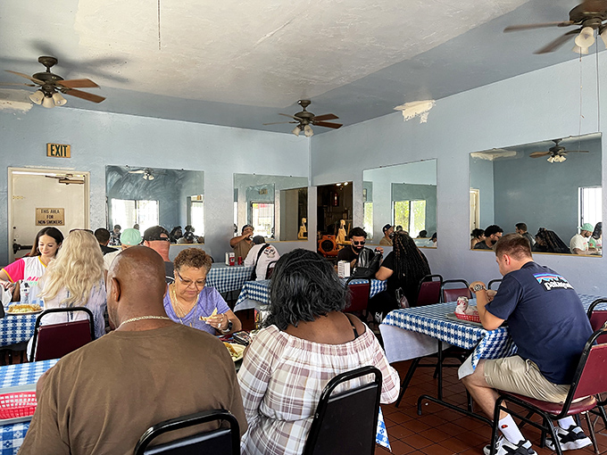 A dining room where strangers become temporary family, united by the universal language of "mmm" and "pass the hot sauce."