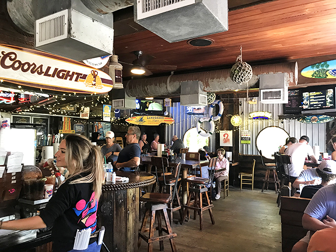 Where college pennants and fishing trophies create the backdrop for island memories. Every barstool has a story; every table a regular.