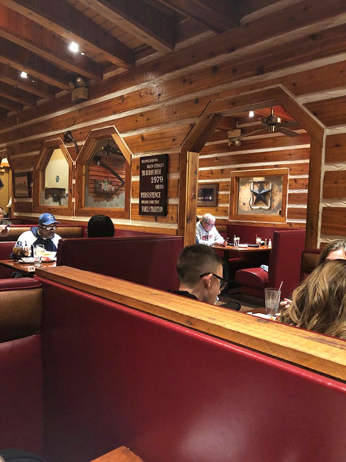 Cozy booths with rustic wooden dividers offer the perfect setting for everything from family dinners to quiet conversations.