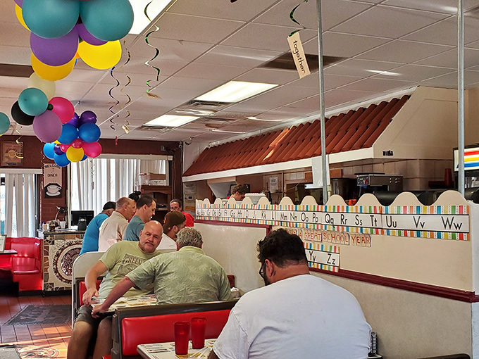 The alphabet border suggests children are welcome, but those balloons hint at celebrations happening in this community gathering spot.
