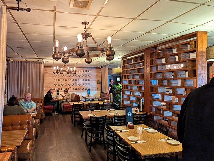 The dining room buzzes with conversation as patrons engage in America's favorite pastime: the pursuit of exceptional beef in good company.