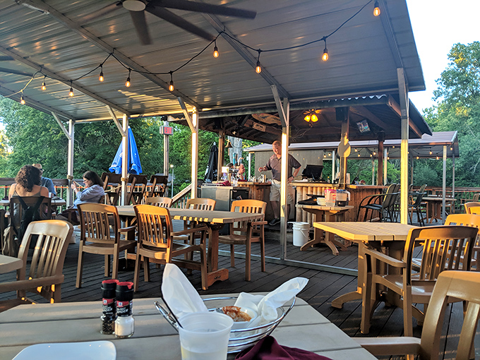 The outdoor dining area transforms ordinary meals into al fresco adventures. Even Tuesday night dinners feel special under string lights and open sky.