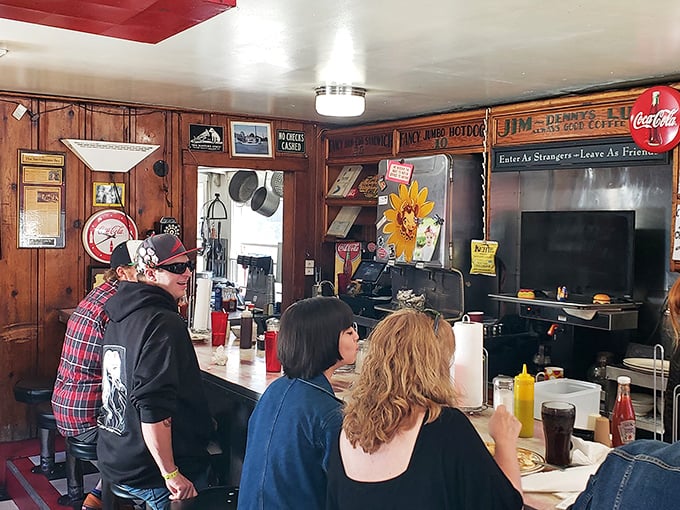 Strangers become neighbors at Jim Denny's counter, where conversations flow as freely as the coffee refills.