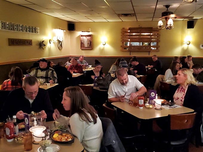 A bustling dining room filled with locals who know the secret to happiness: good food, better company, and the warm embrace of a true Wisconsin supper club.