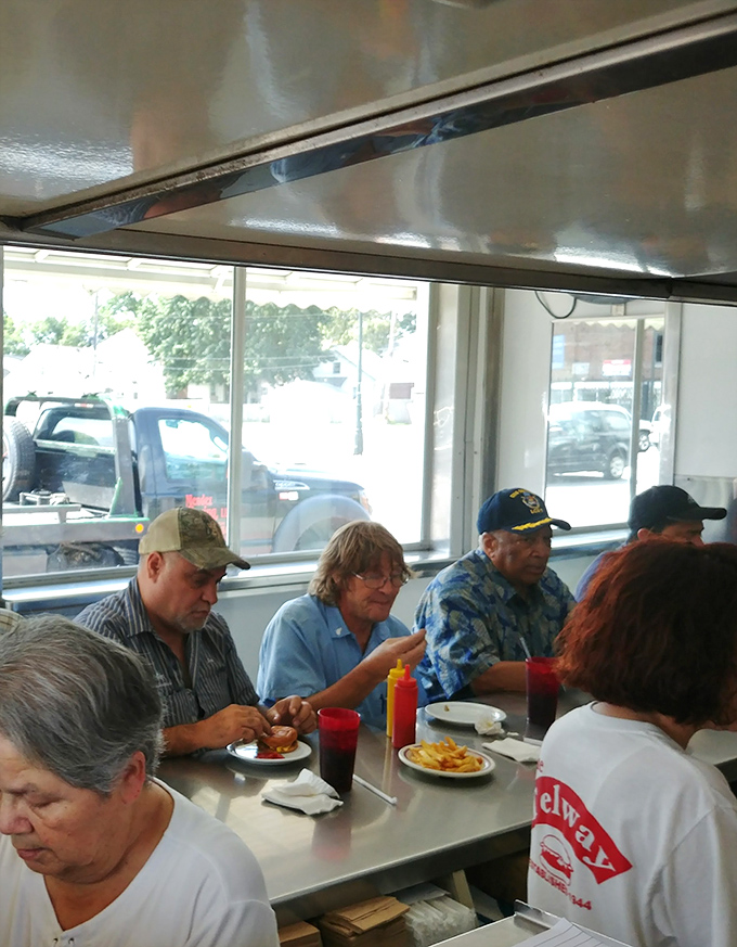 Where strangers become temporary neighbors, sharing nothing but counter space and the universal language of "mmm, that's good."