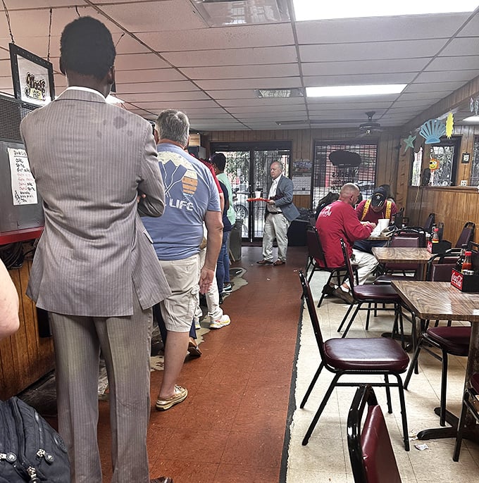The line forms early at Mack's, where suits and t-shirts stand shoulder to shoulder in the democracy of deliciousness.