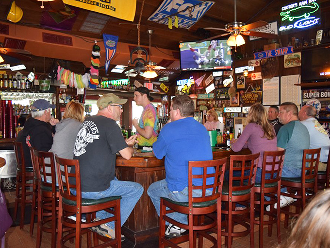 The circular bar&mdash;where strangers become friends over cold drafts and hot seafood. That tie-dye shirt on the bartender isn't just clothing, it's a philosophy.